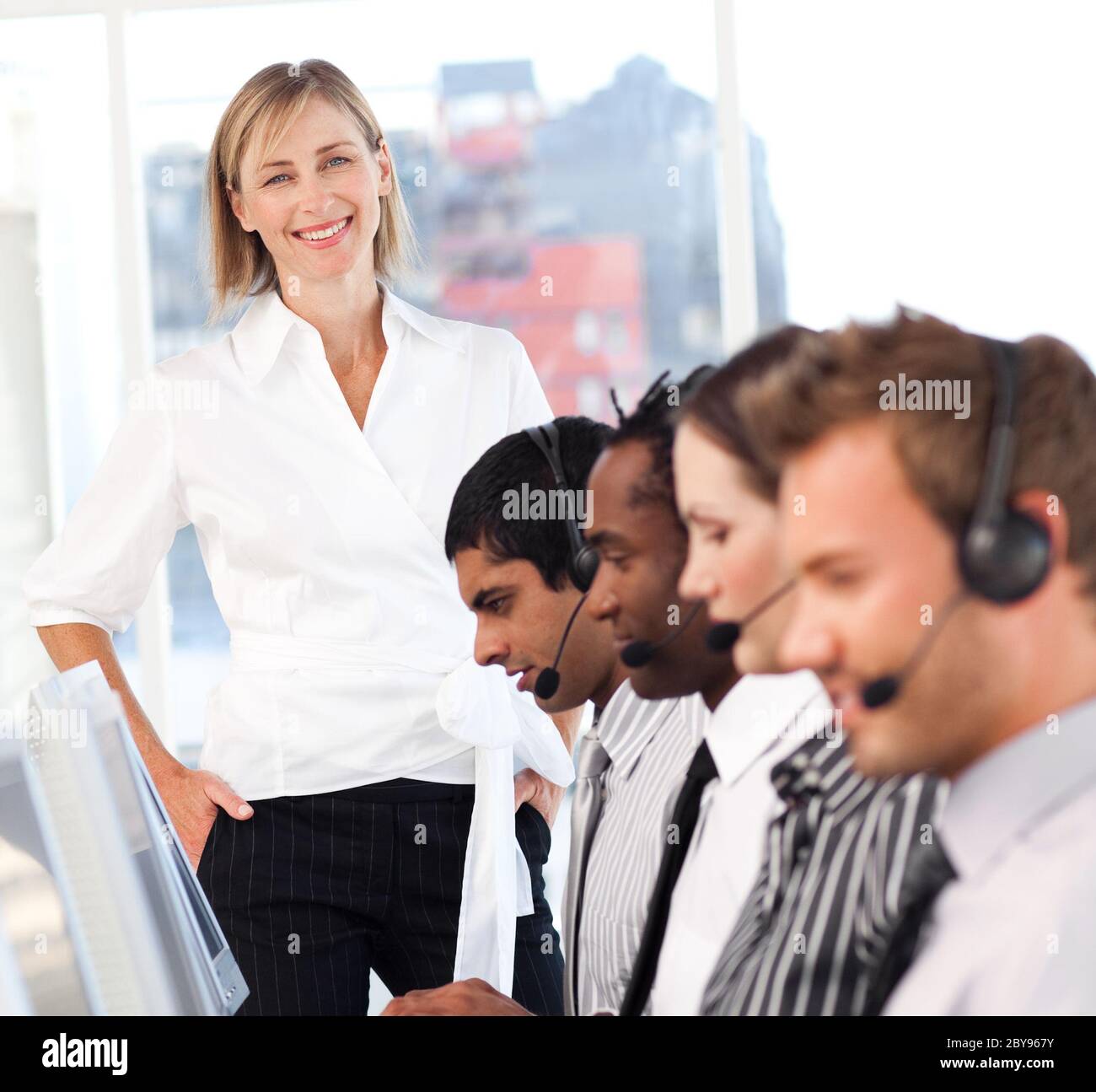 Serious female manager leading her representative team Stock Photo - Alamy