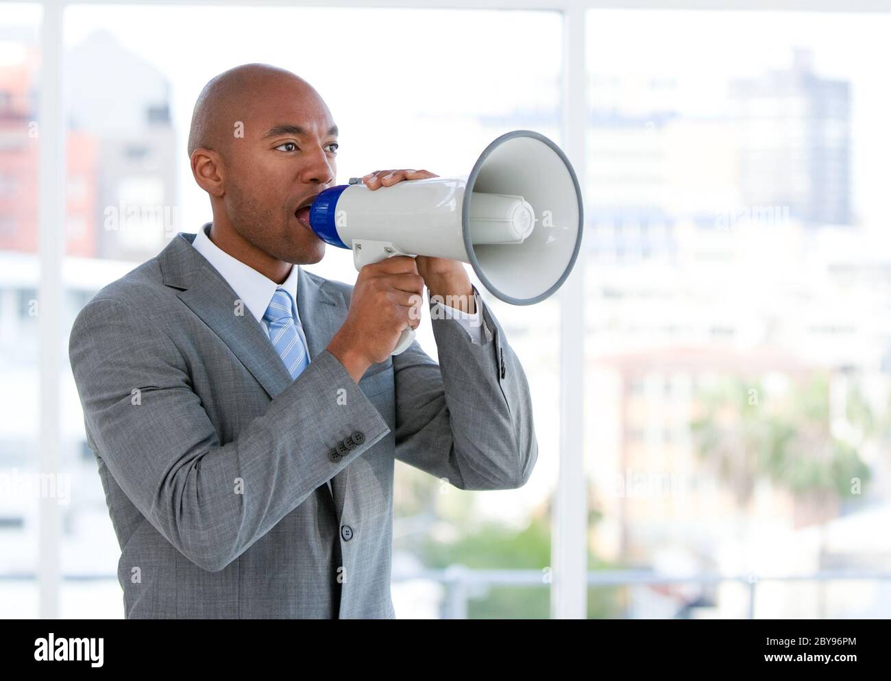 Man yelling through bullhorn hi-res stock photography and images - Alamy