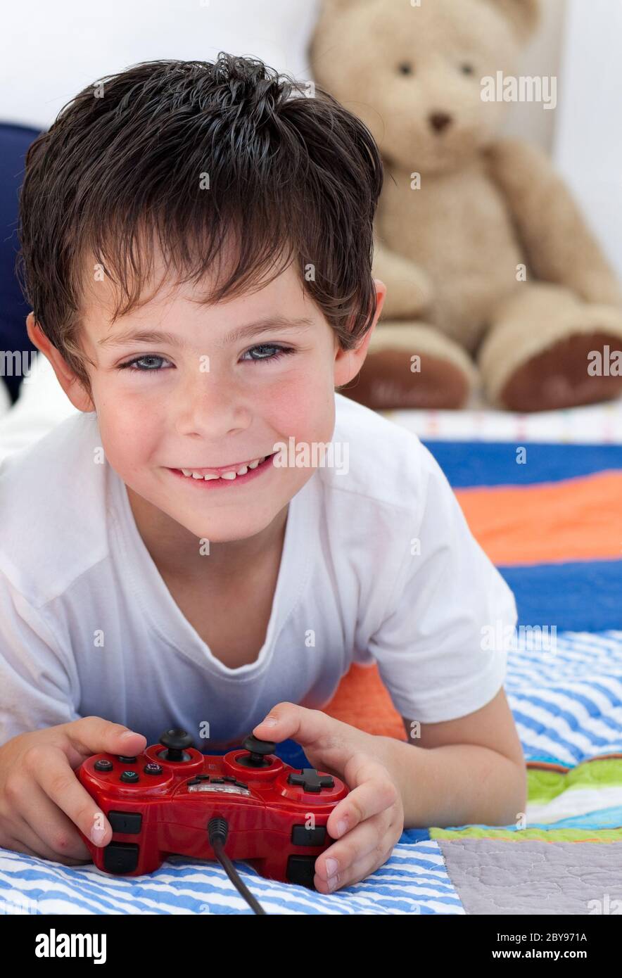 Little boy playing video games Stock Photo - Alamy