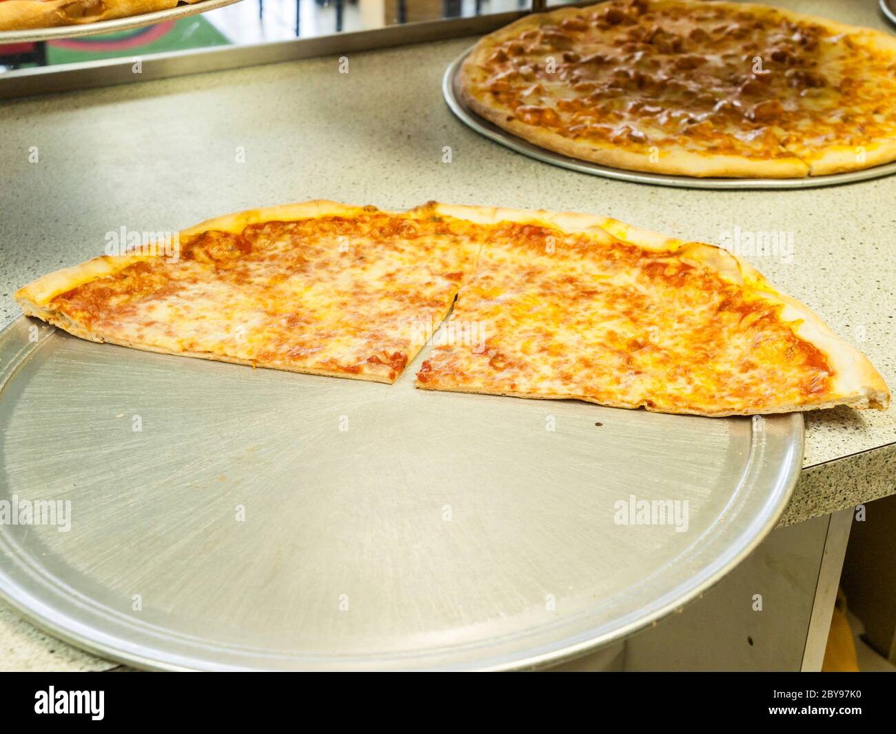 Pizza and pizza making Pizza on display at counter Stock Photo - Alamy