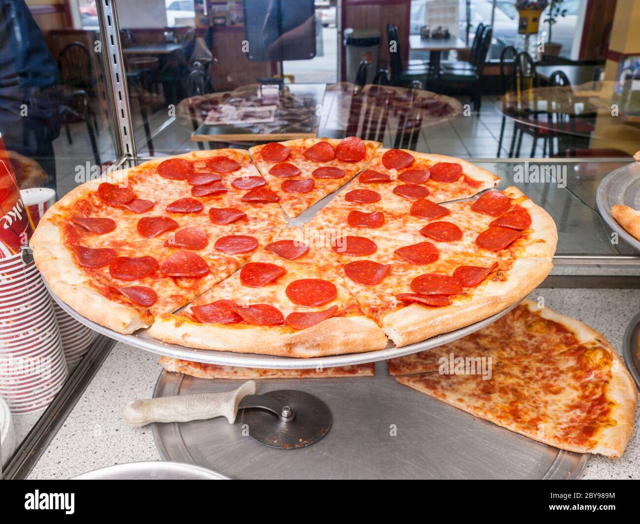 Pizza and pizza making Pizza on display at counter Stock Photo - Alamy