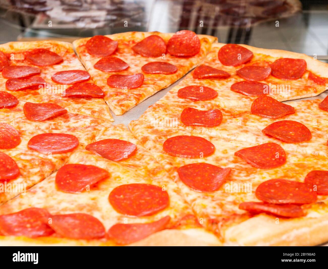 Pizza and pizza making Pizza on display at counter Stock Photo - Alamy