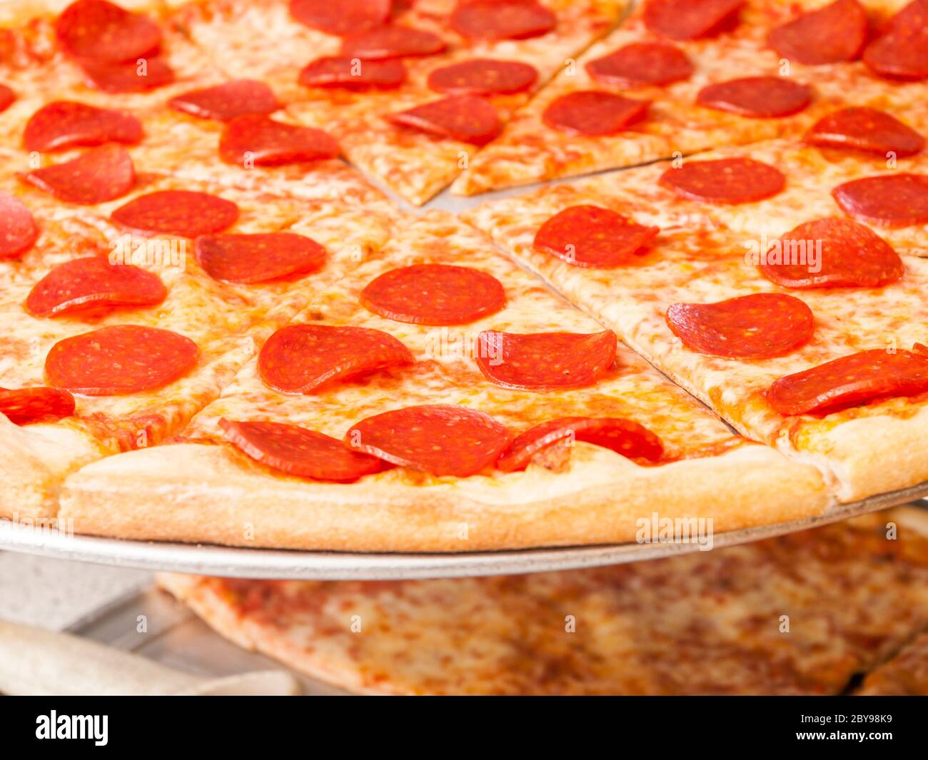 Pizza and pizza making Pizza on display at counter Stock Photo - Alamy