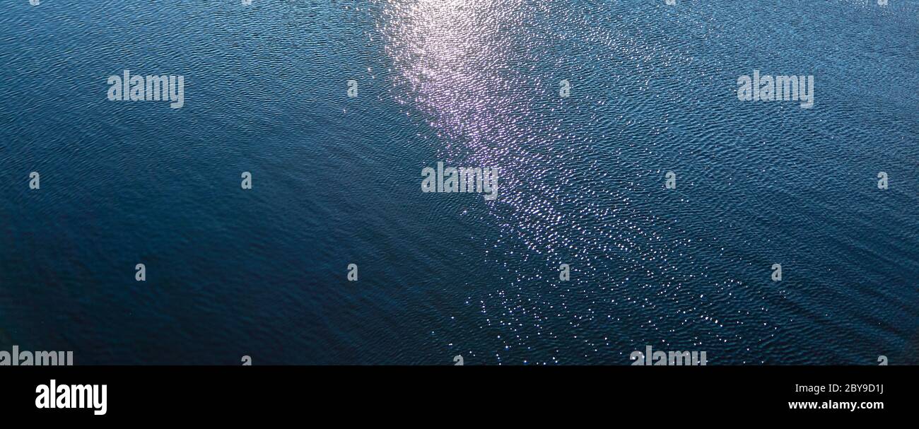 Reflective sun rays and waves as an abstract texture background Stock ...