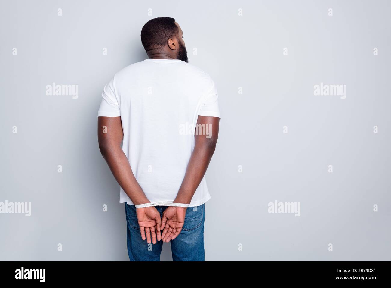Hands tied behind back hi-res stock photography and images - Alamy
