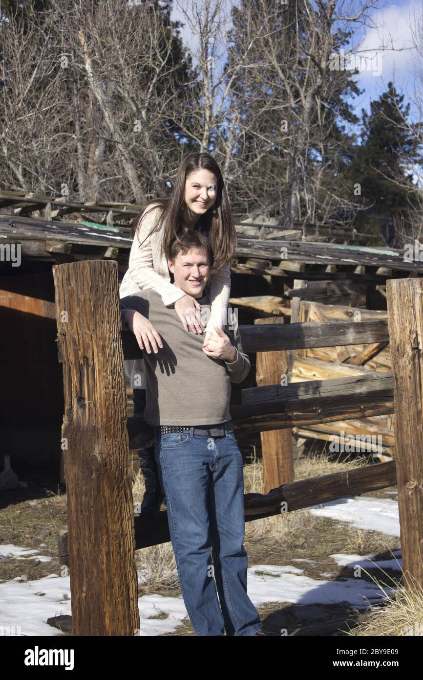 old barn with a young couple in love Stock Photo - Alamy