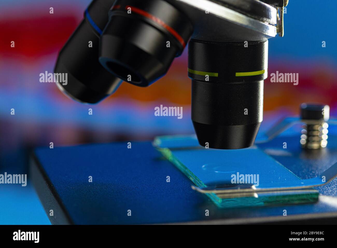 Close up photo of a microscope lenses examining glass sample Stock ...