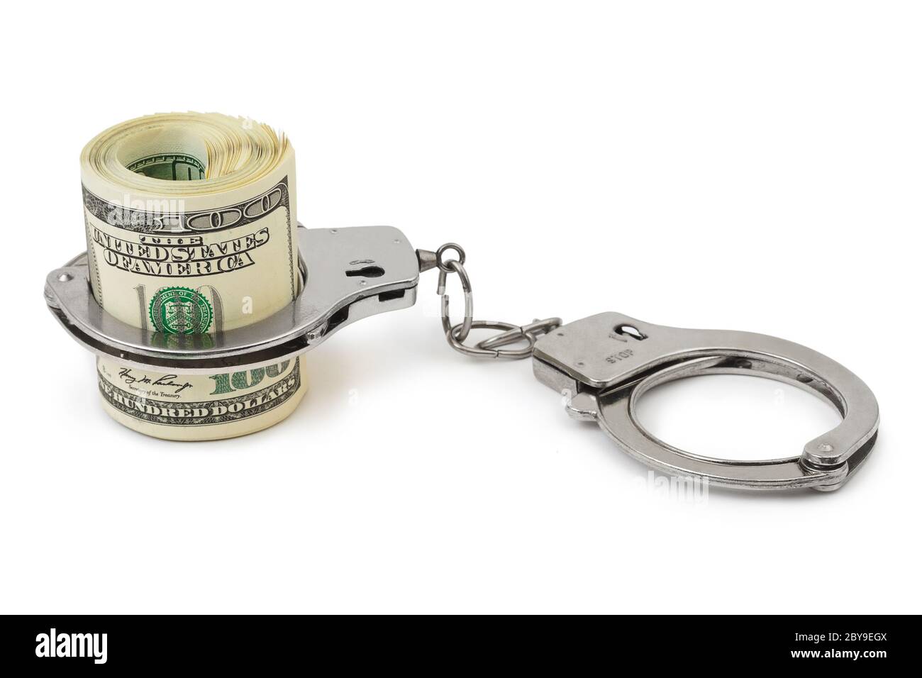 Money and handcuffs Stock Photo - Alamy