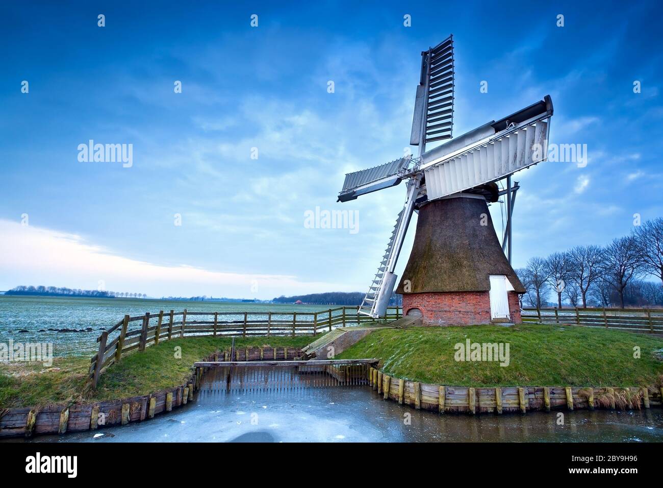 Dutch windmill in winter Stock Photo - Alamy