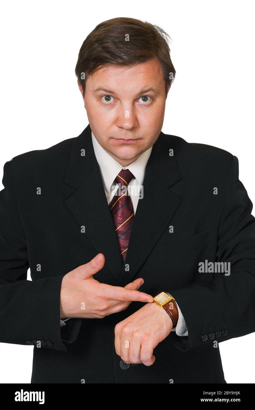 Man pointing at watch Stock Photo - Alamy