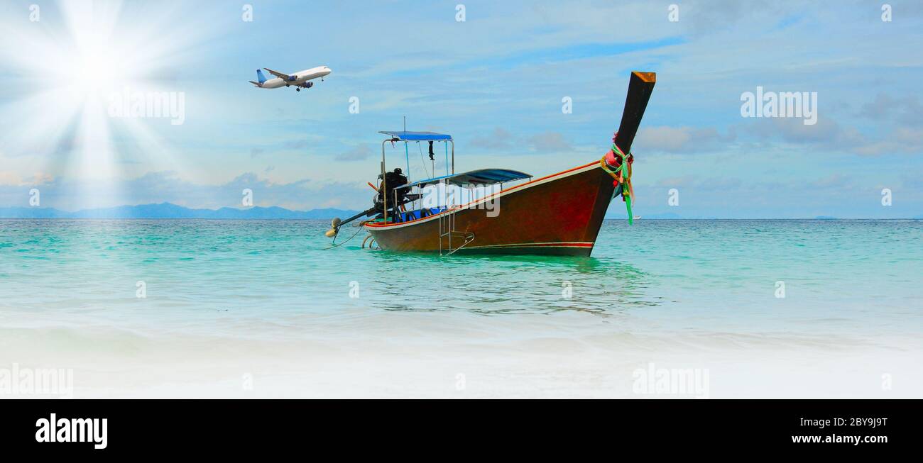 Longtail boat on the sea tropical beach Stock Photo - Alamy