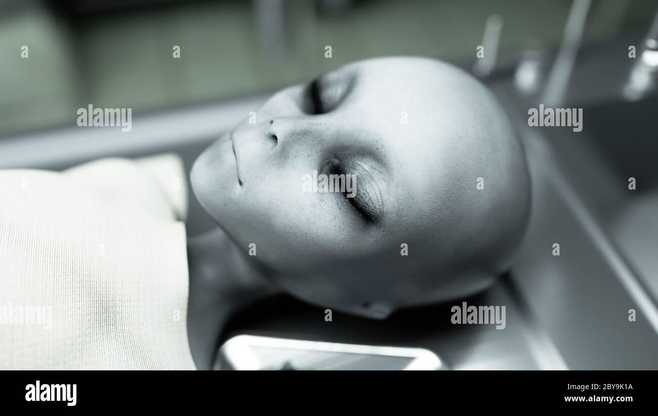 The dead alien in the morgue on the table. Futuristic autopsy concept ...