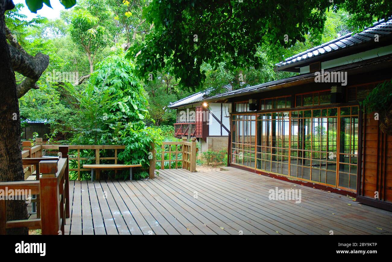Traditional asian architecture with wooden terrace in the green Stock ...