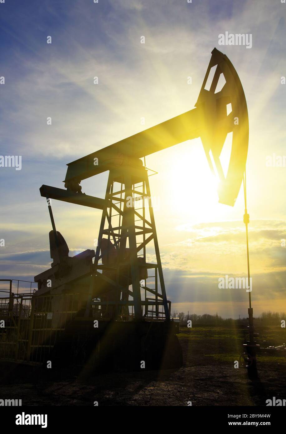 working oil pump at sunset Stock Photo - Alamy