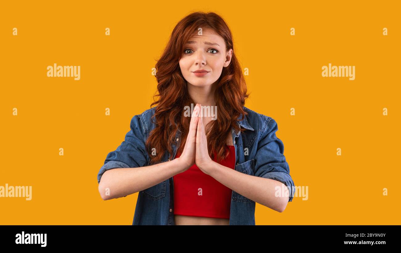 Millennial Girl Keeping Hands In Praying Gesture, Panorama, Studio Shot ...
