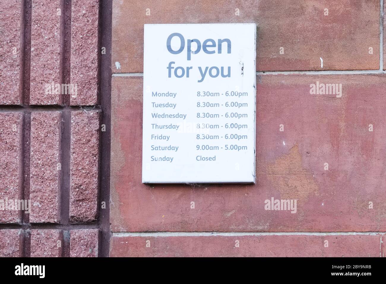 Business shop opening hours day and time sign Stock Photo - Alamy