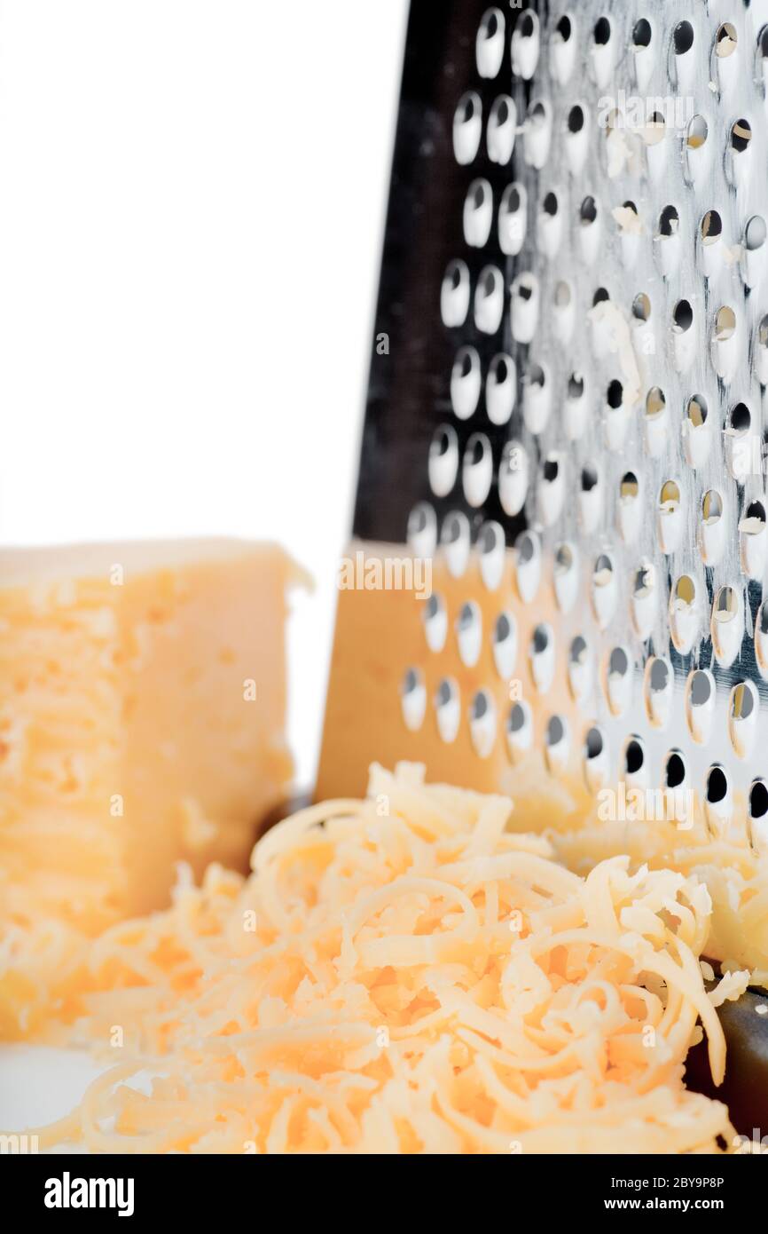 Grated cheddar cheese metal cheese grater hi-res stock photography and ...