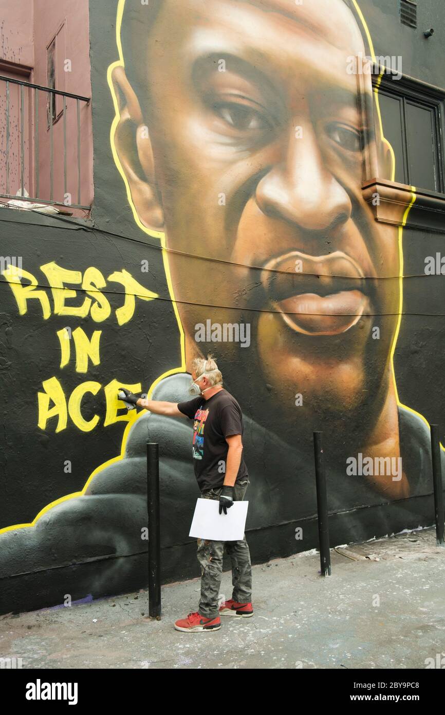 Artist Shane Grammer puts finishing touches on mural to honor the ...