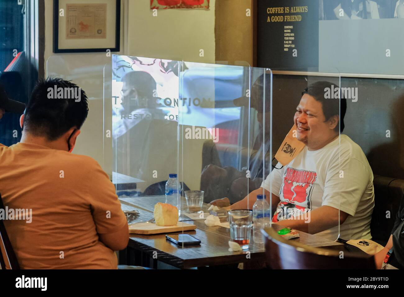 Jakarta, Indonesia. 09th June, 2020. Customers dines in behind an ...