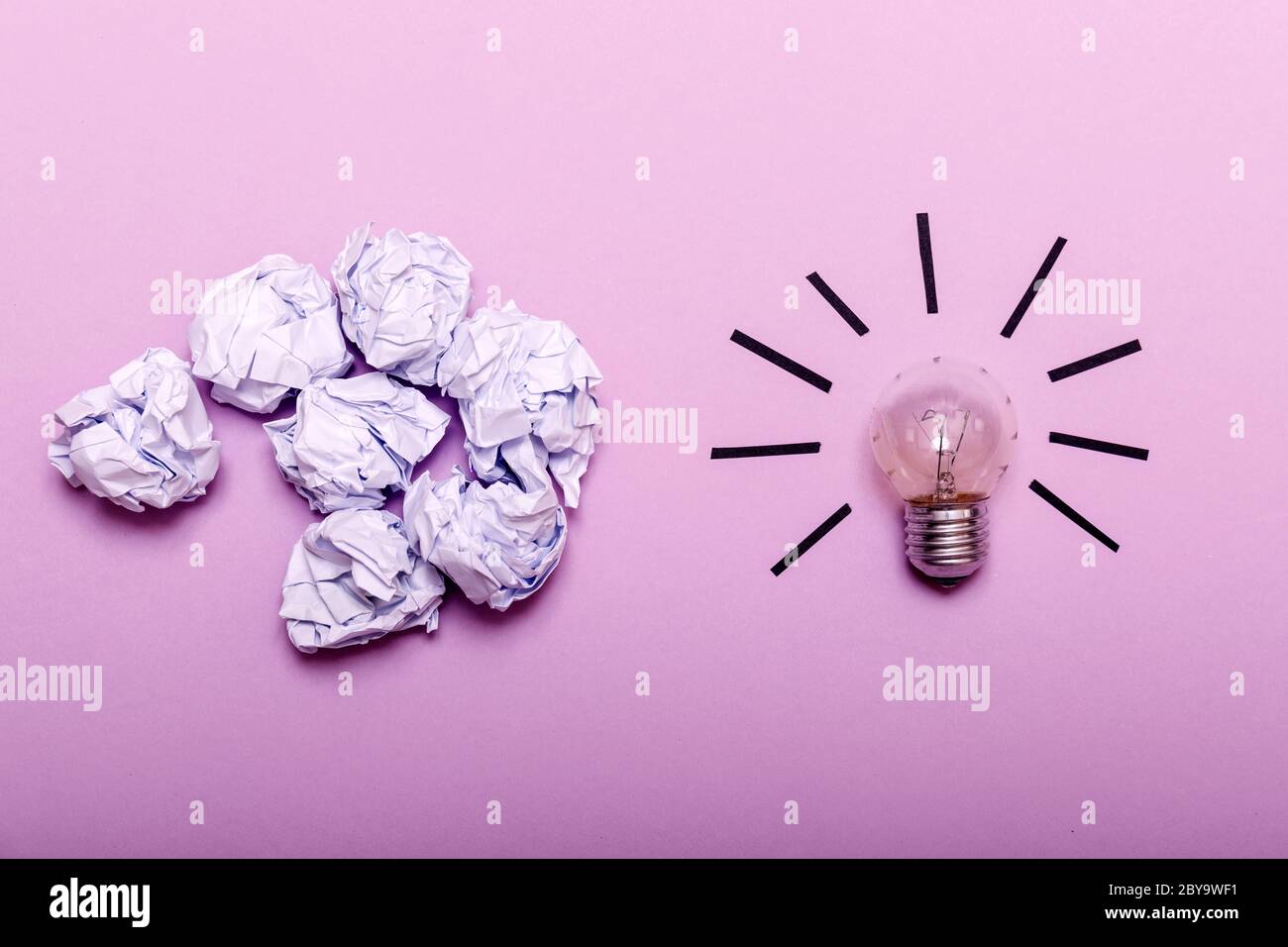 Inspiration concept crumpled paper and light bulb metaphor for good ...