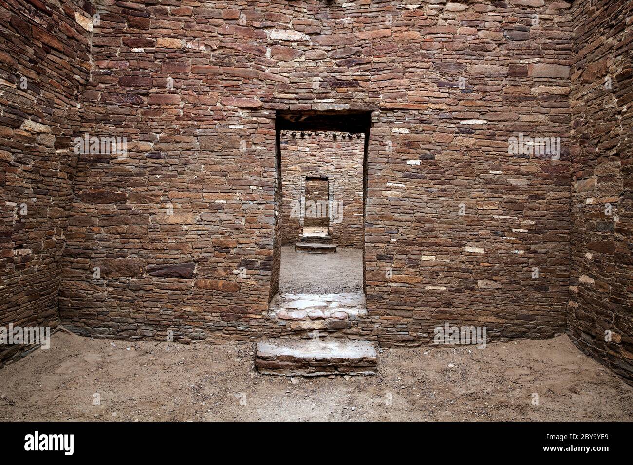 NM00602-00...NEW MEXICO - Masonry stone walls and doorways at Pueblo ...