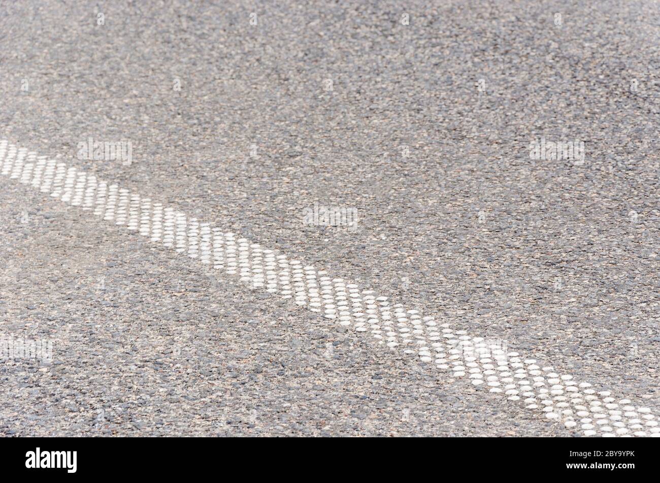 dividing line on an asphalt road Stock Photo - Alamy