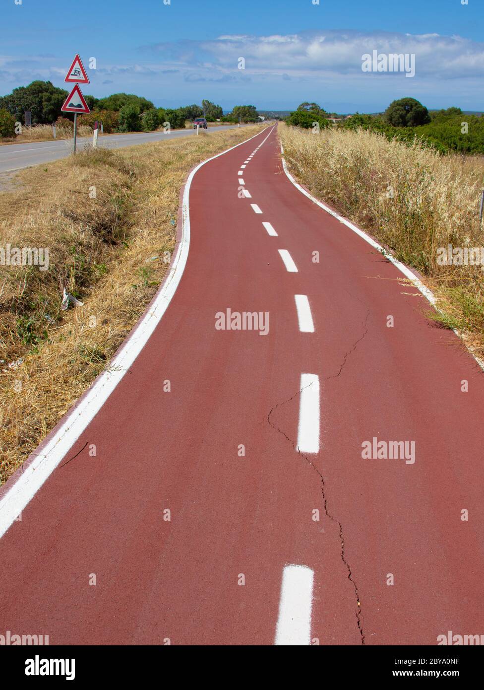 Bicycle path, two way cycling track with bicycle signs painted white ...