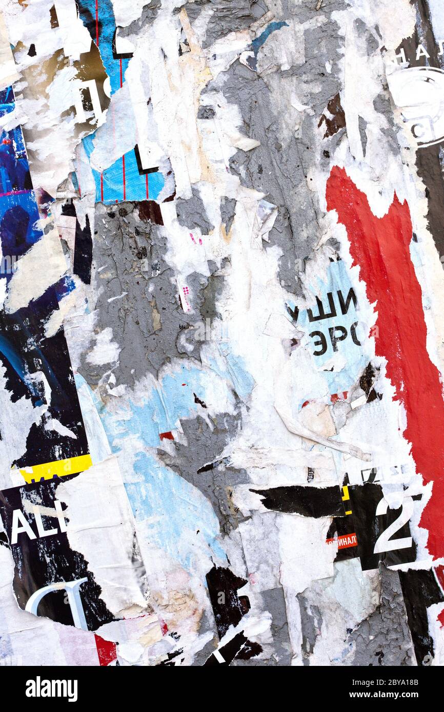 scraps of posters on wall Stock Photo - Alamy