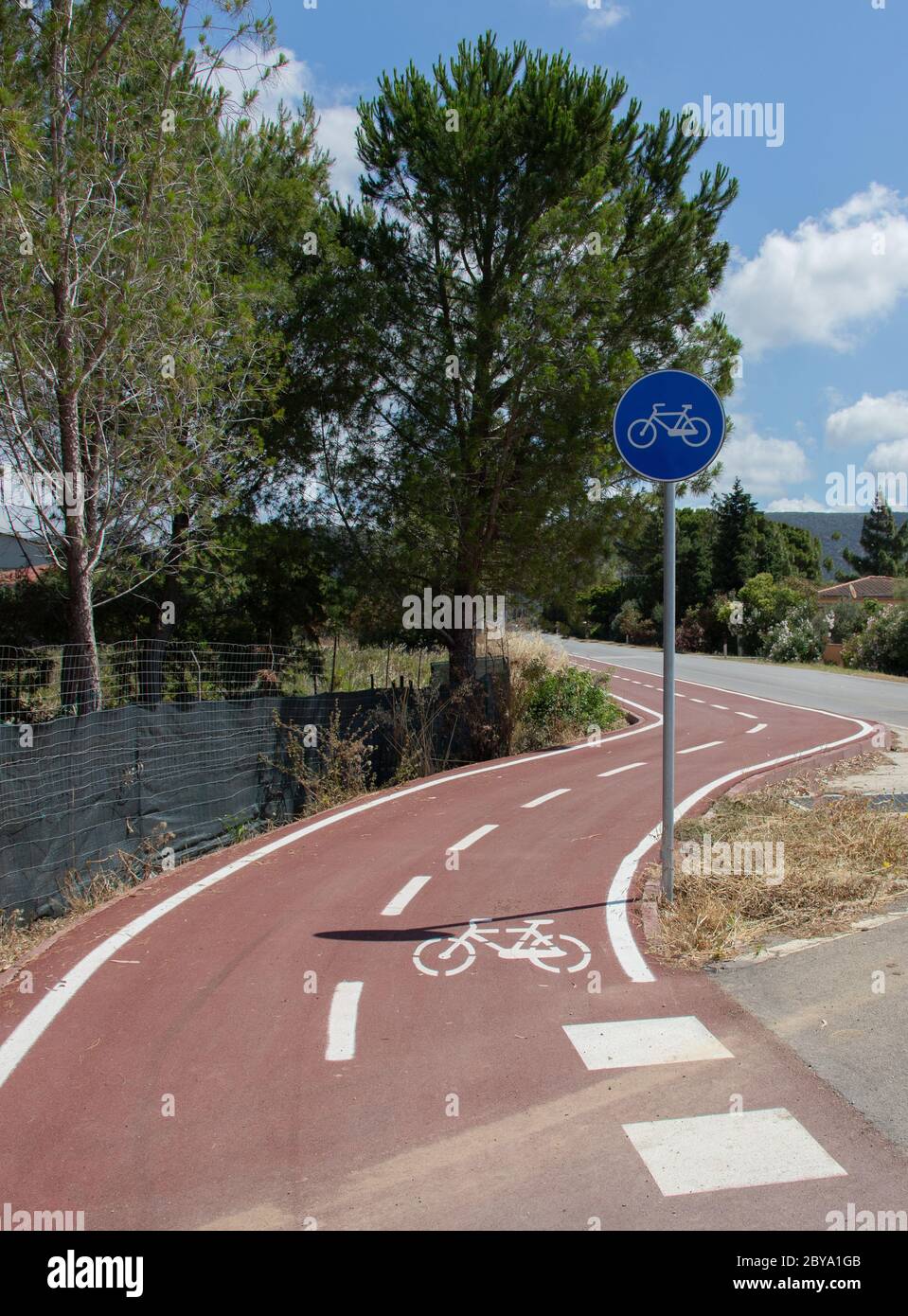 Bicycle path, two way cycling track with bicycle signs painted white ...