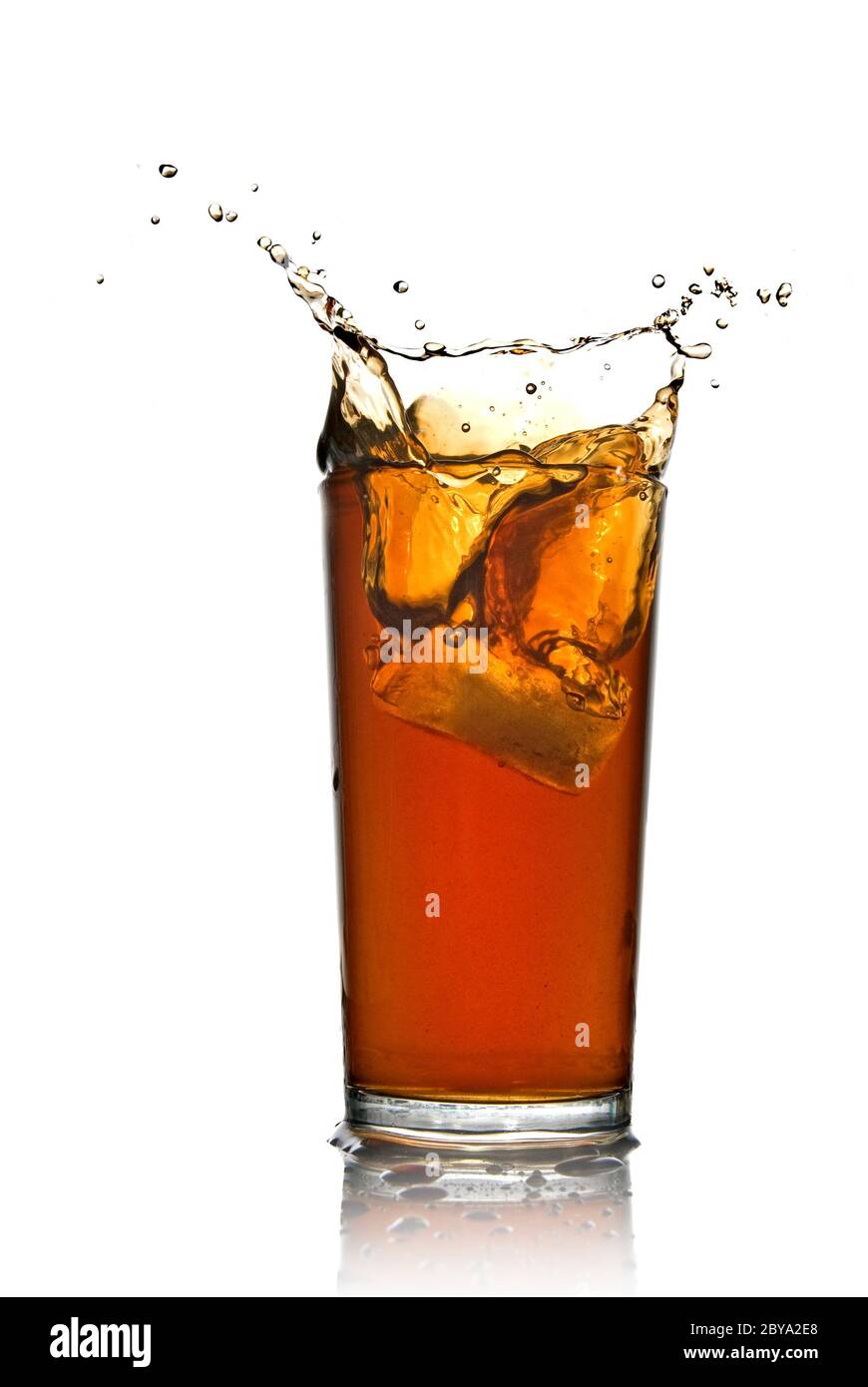 Beautiful splash of cola in glass isolated on white Stock Photo - Alamy