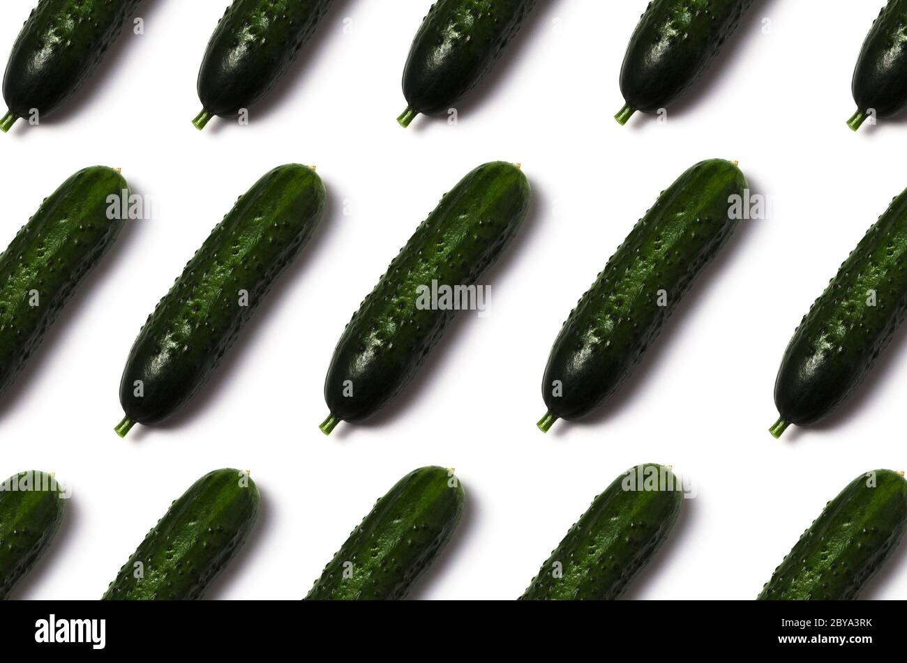 cucumbers with shadow on a white background Stock Photo - Alamy