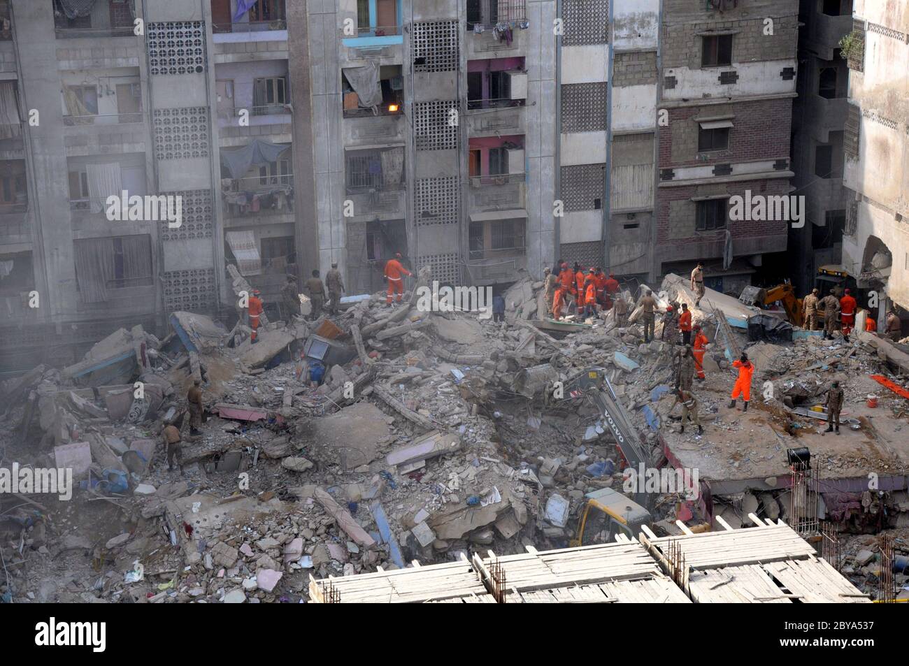 Karachi, Pakistan. 9th June, 2020. Rescuers work at the site where a ...