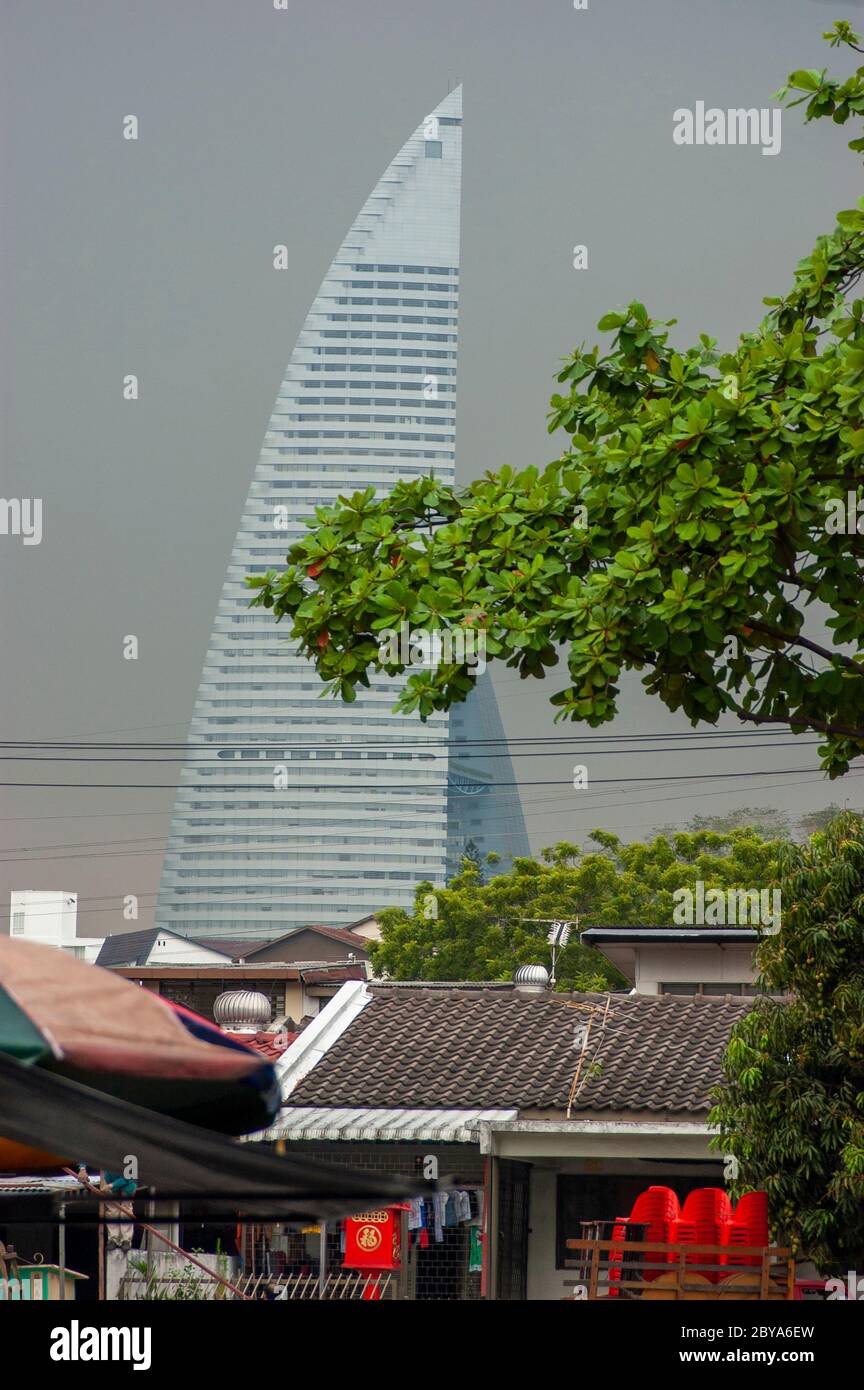 Celcom building in Kuala Lumpur, towering over older residential houses ...