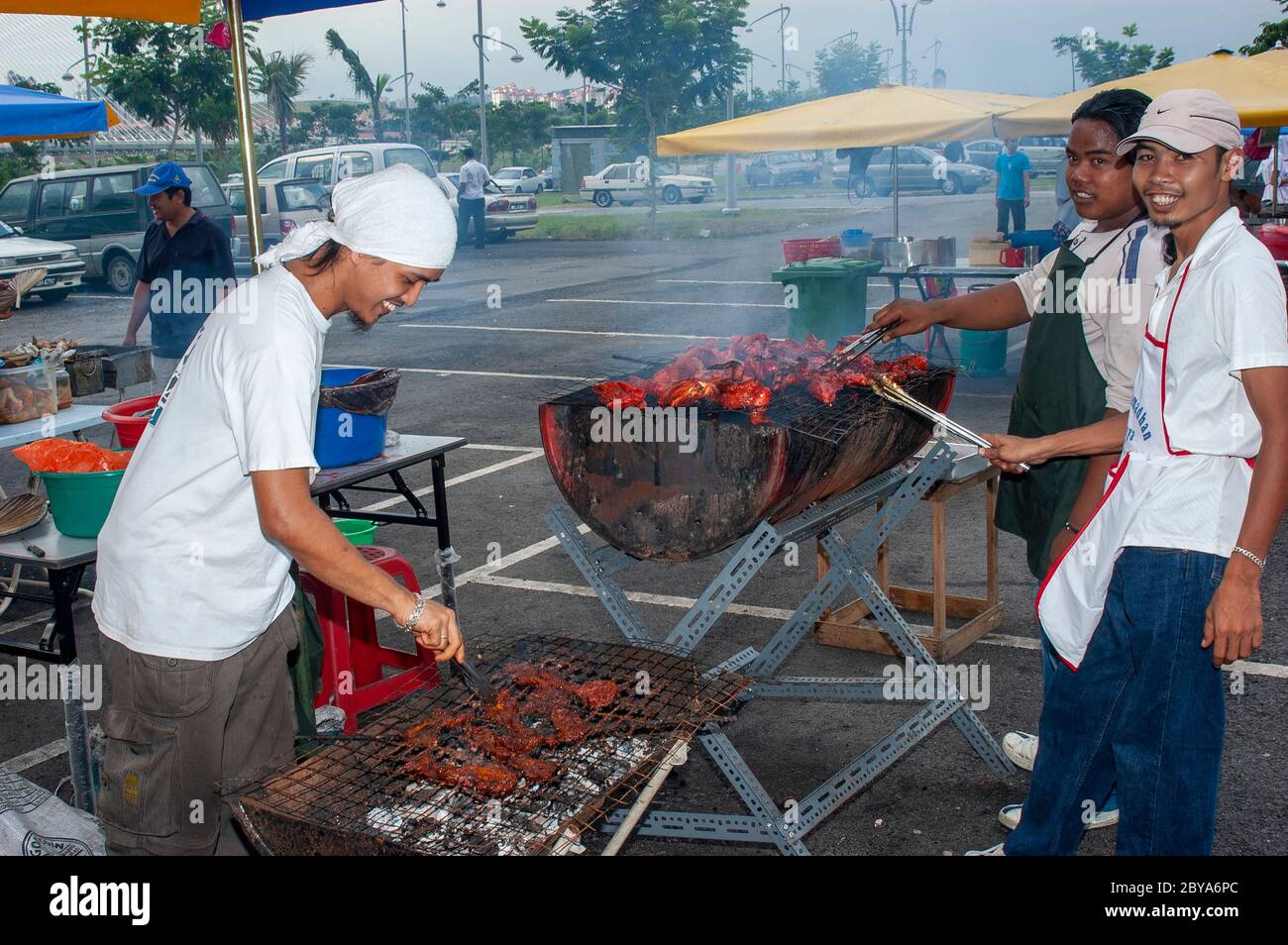 Stall holders preparing and selling fresh food during Ramadan in ...
