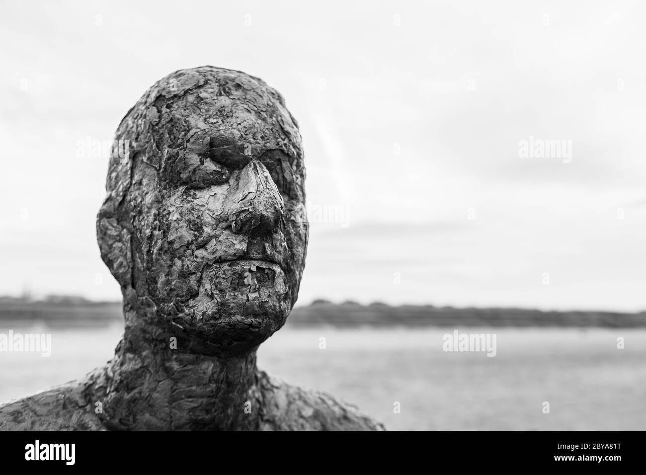 Head and shoulders of an Iron Man on the beach at Crosby near Liverpool ...