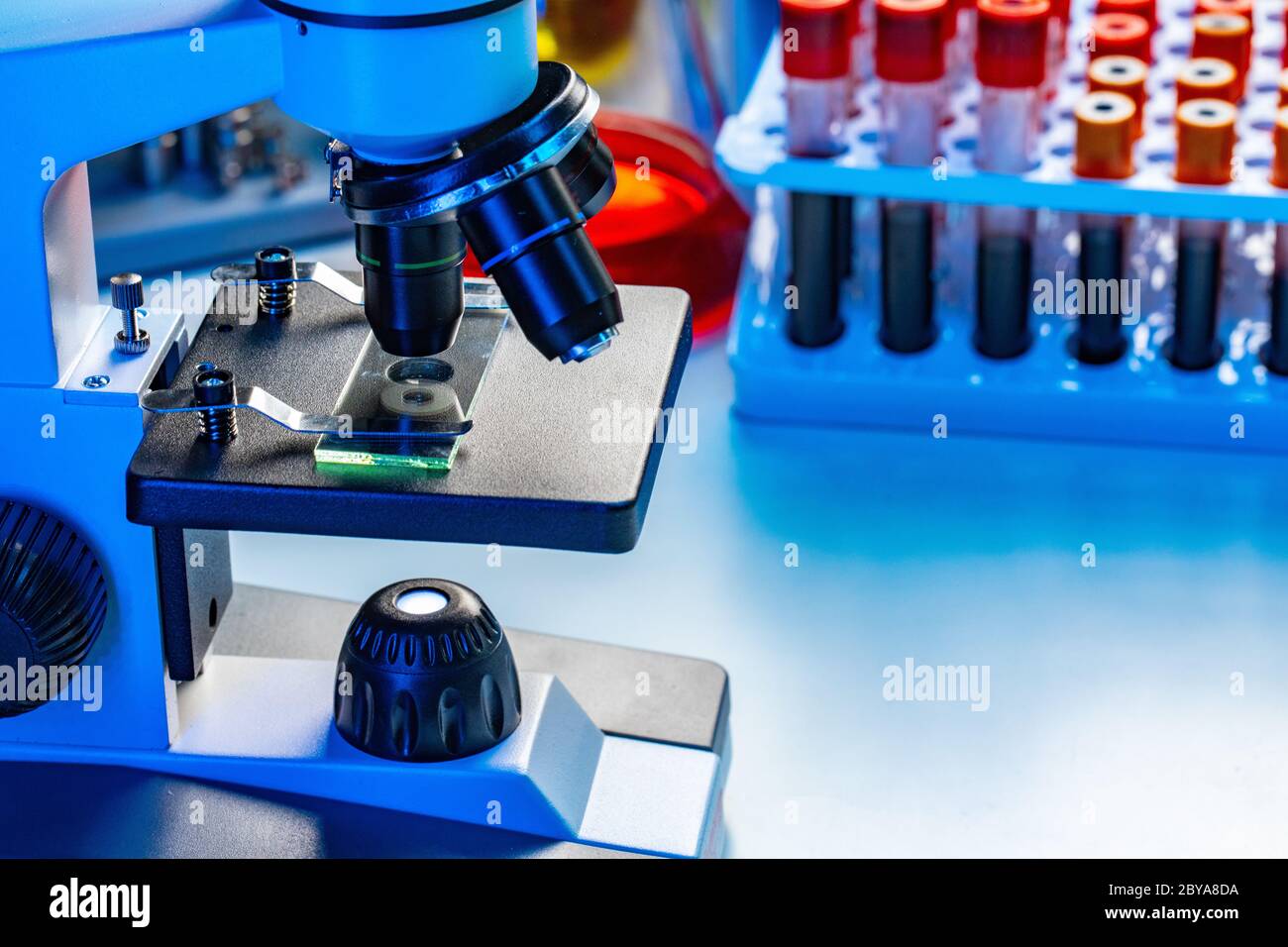 Microscope with blood samples test tubes close up Stock Photo - Alamy