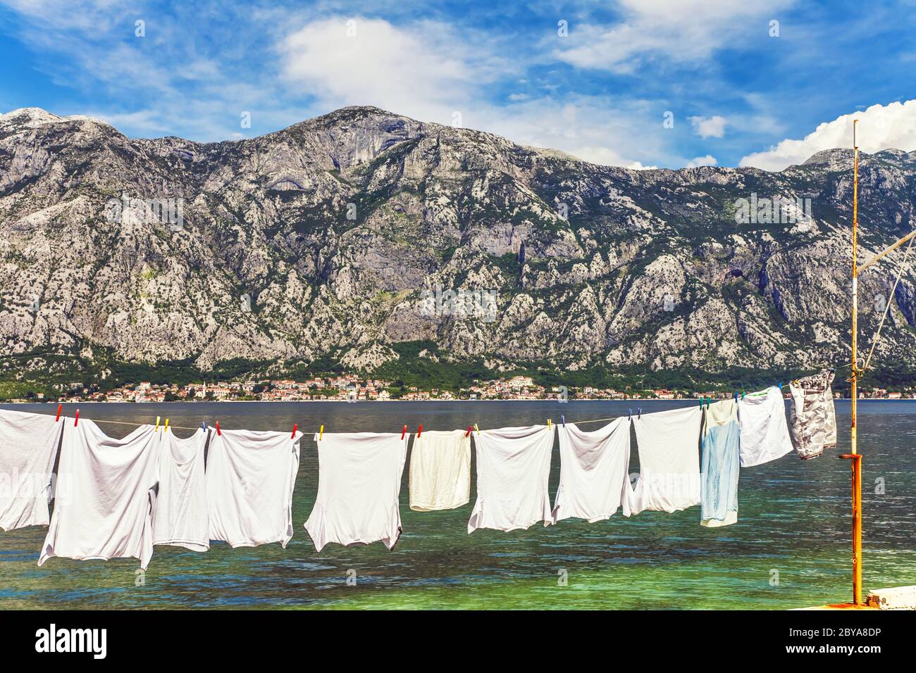 Wet clothes drying on the pier near the sea Stock Photo - Alamy