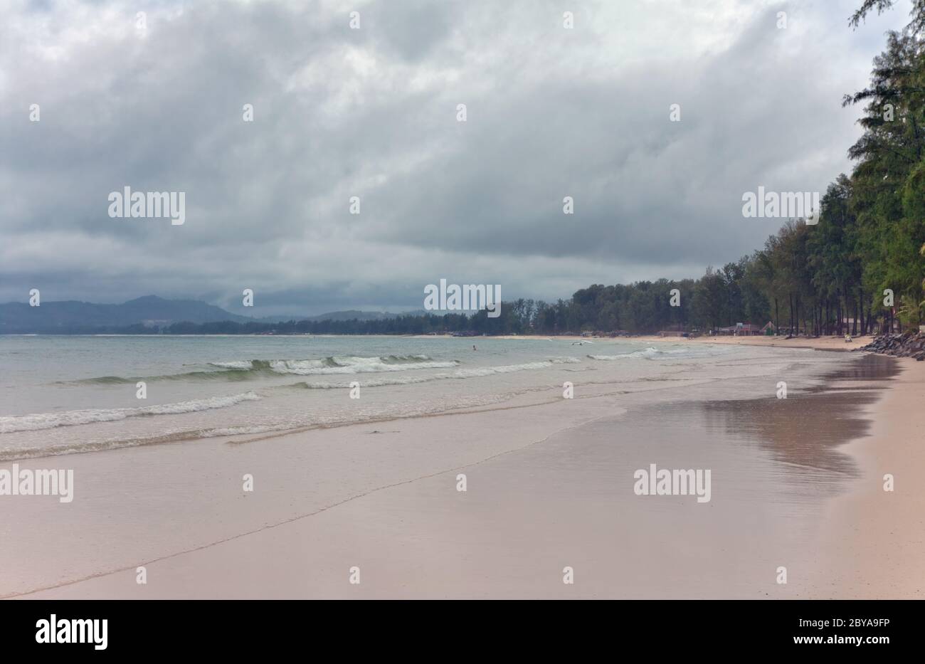 tropical beach under gloomy sky Stock Photo - Alamy