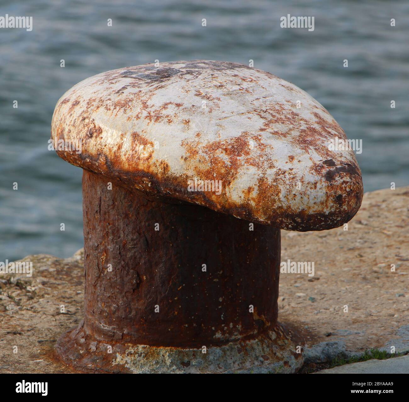 Rusted bollard on the edge of the pavement Santander bay Cantabria ...