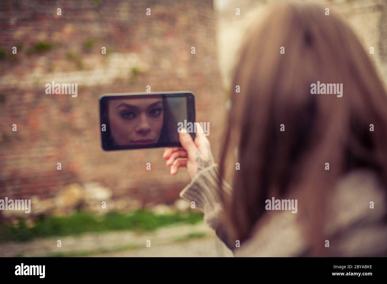 Woman taking smartphone photo mirror hi-res stock photography and ...
