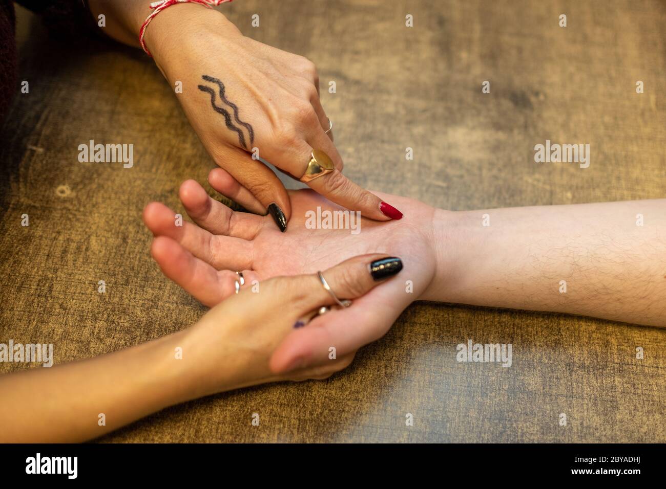 fortune teller lady is telling about your future by palm reading Stock ...