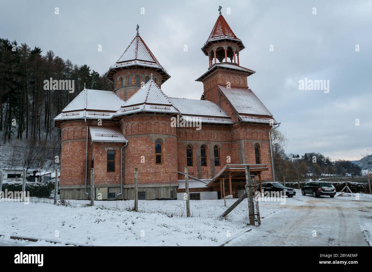 Church made of bricks. Rooftop covered with snow. Winter scene Stock ...