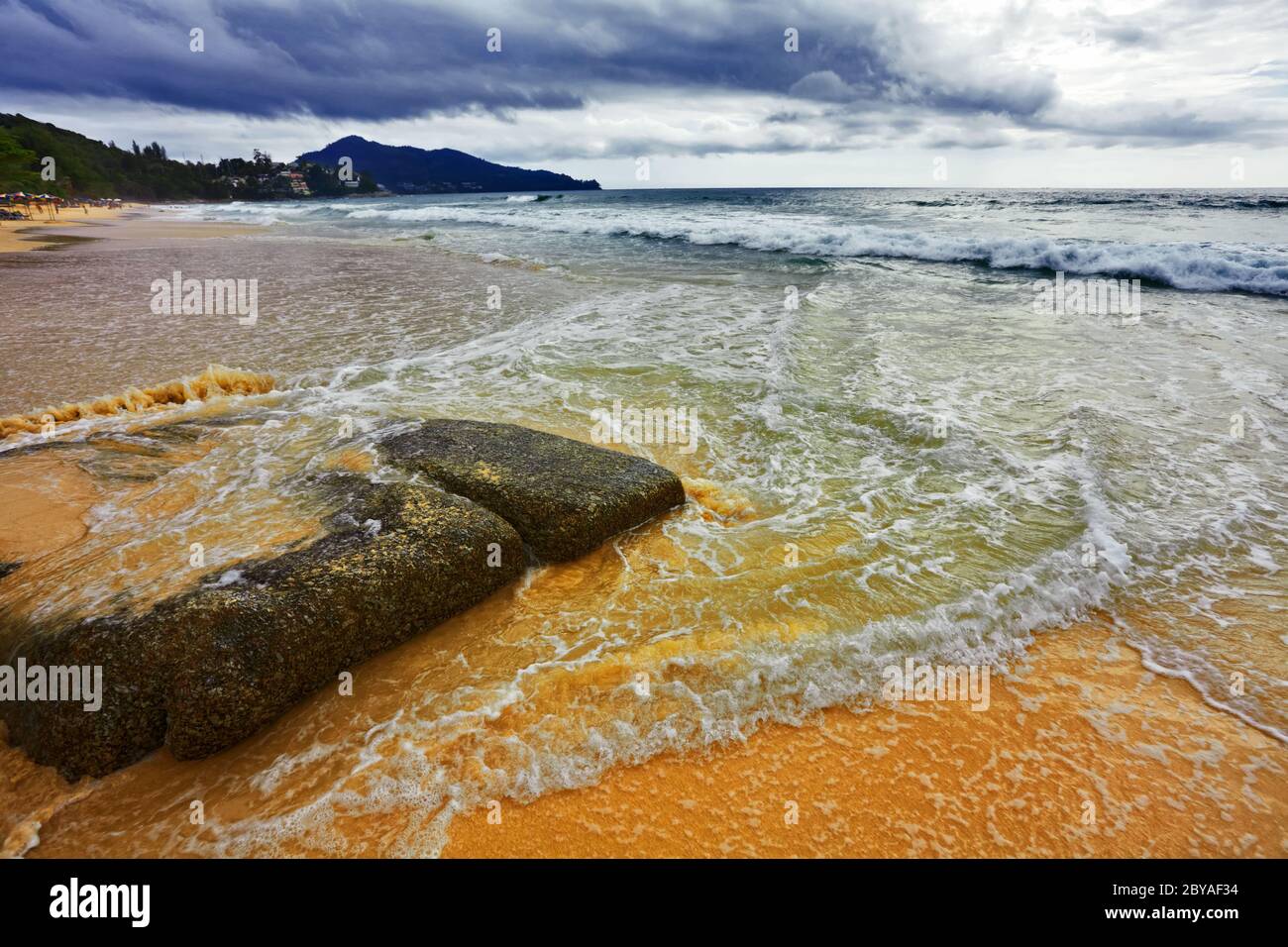 tropical beach under gloomy sky Stock Photo - Alamy