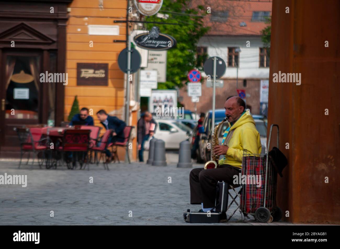Man playing saxophone on street hi-res stock photography and images - Alamy