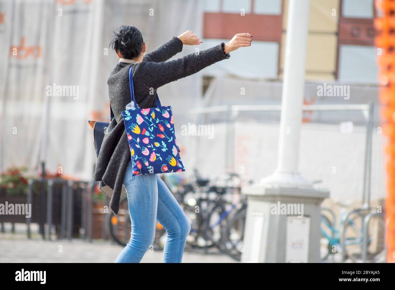 Woman walking on the street. Real people Stock Photo - Alamy