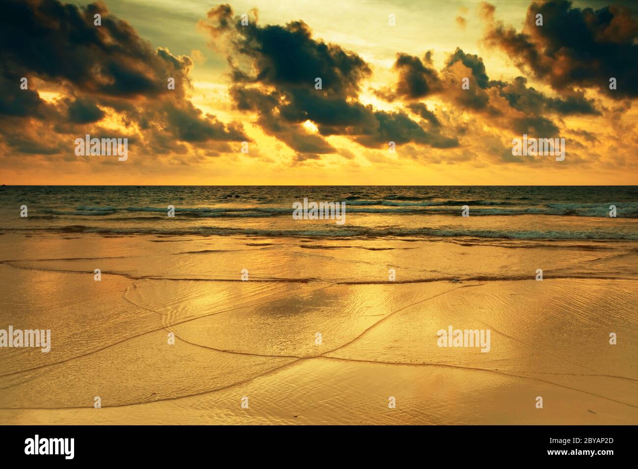 Tropical beach at sunset Stock Photo - Alamy