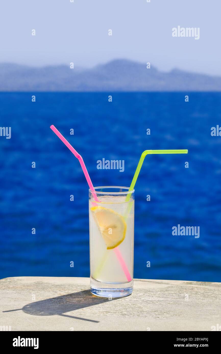 Cocktail on marble table at beach Stock Photo - Alamy