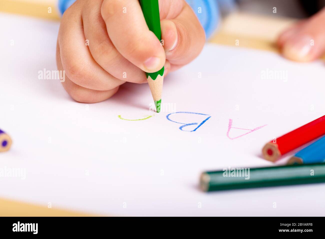 Learning to write Stock Photo - Alamy