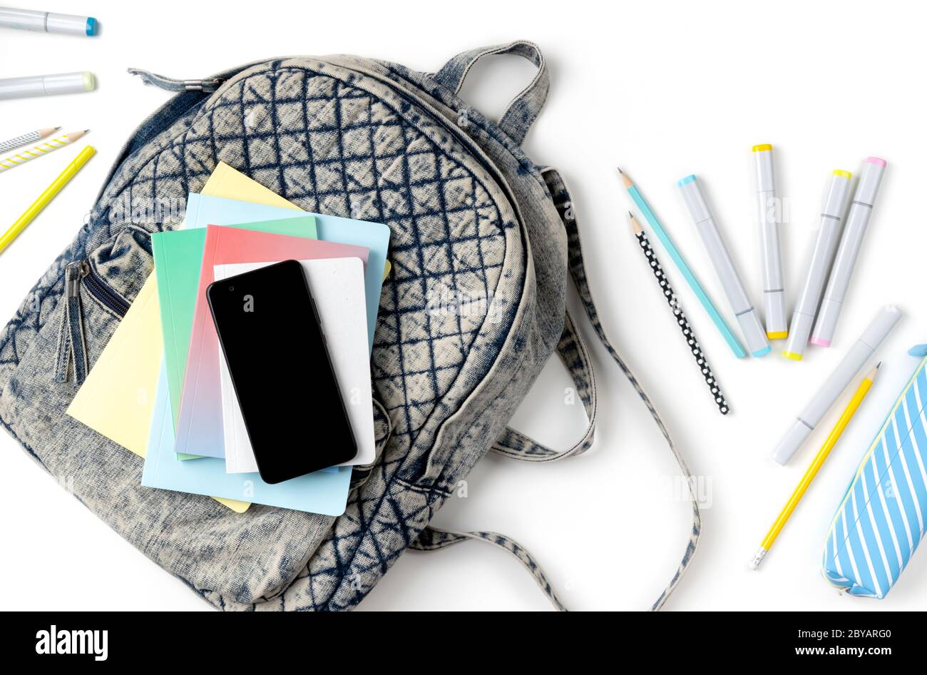 Flat lay top view backpack with different colorful stationery Stock ...