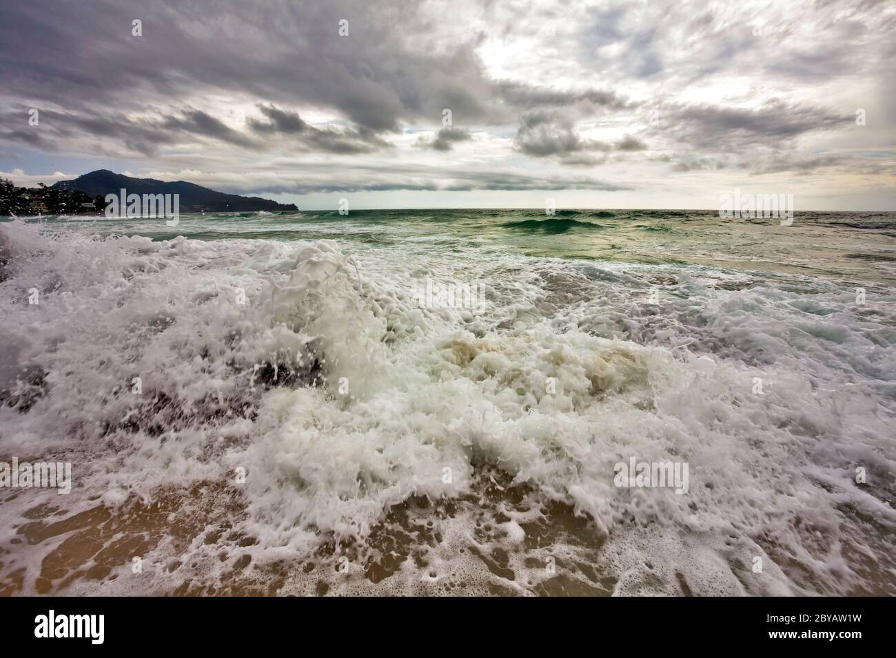 tropical beach under gloomy sky Stock Photo - Alamy